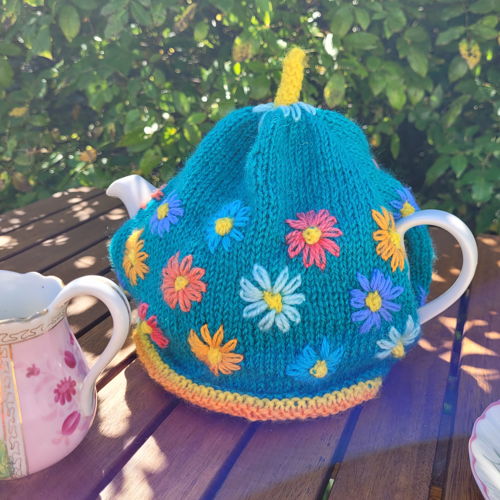 Tea cosie with small flowers and matching egg cosie in 8 ply